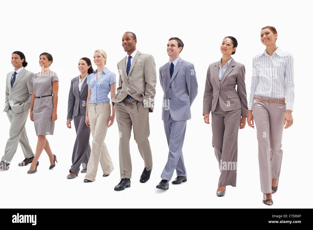 Smiling business team walking Stock Photo - Alamy