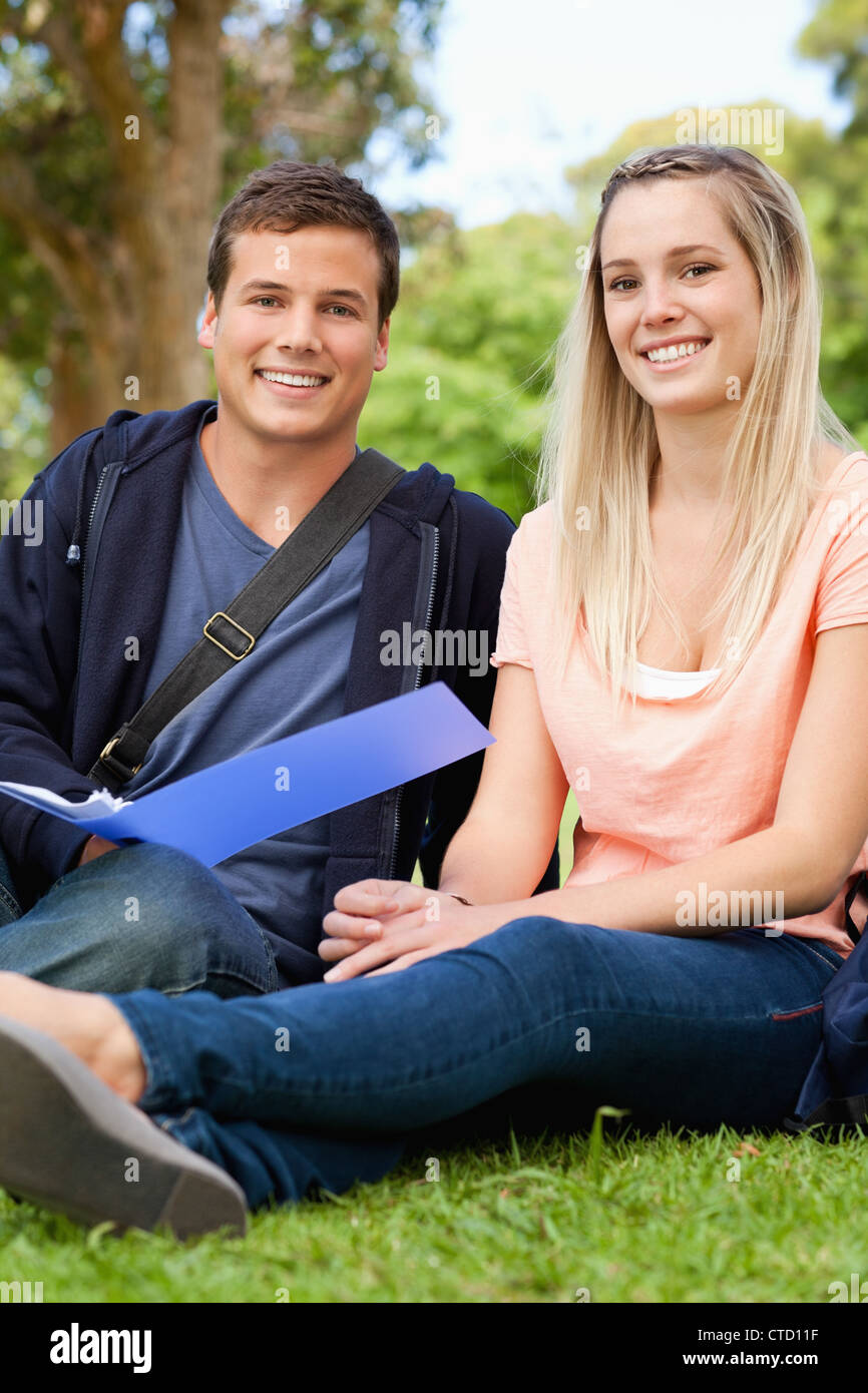 Portrait of a smiling tutor helping a teenager to revise Stock Photo ...