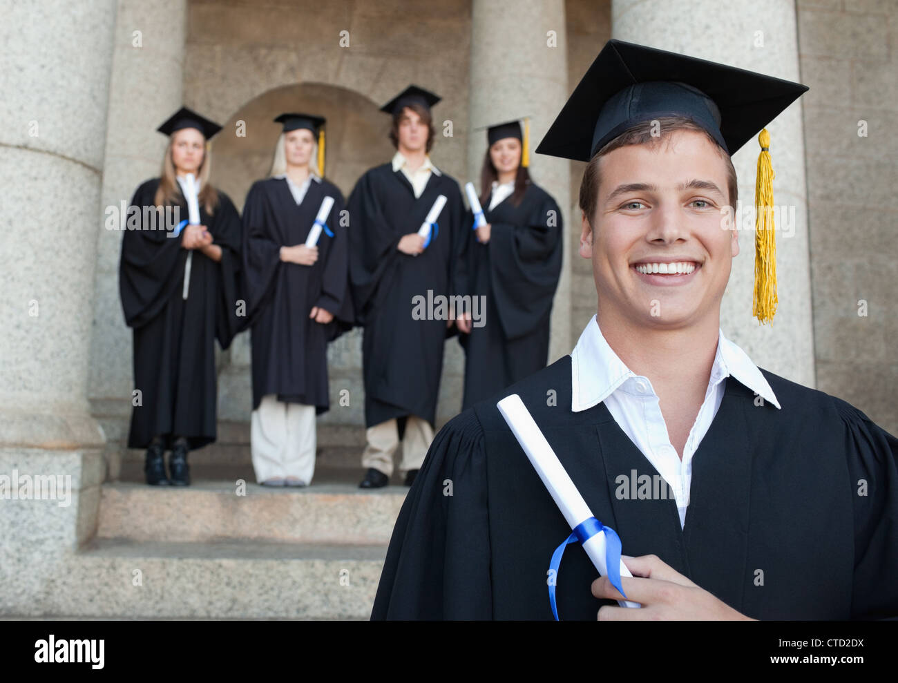 Male college graduate posing outdoors hi-res stock photography and ...