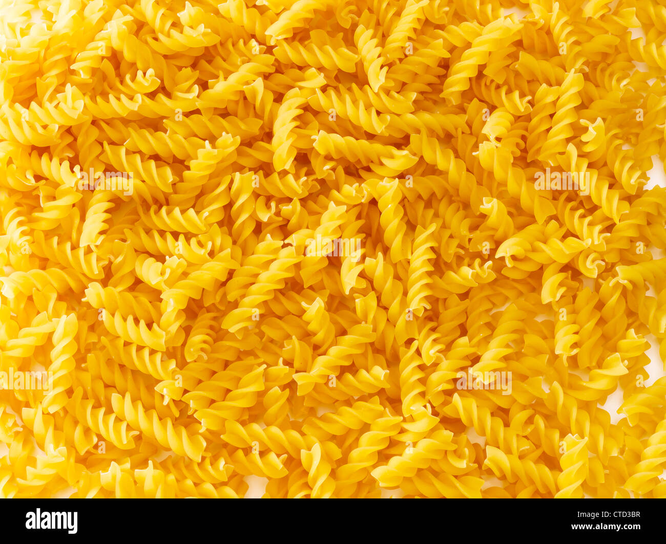 Pile of pasta spread out on a surface Stock Photo - Alamy