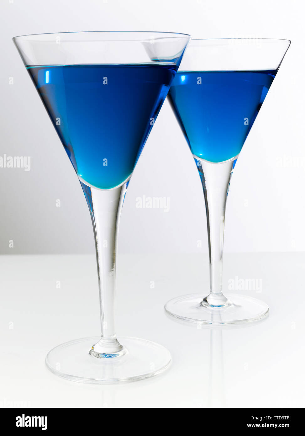 Two blue cocktails in a chique cocktail glass Stock Photo - Alamy