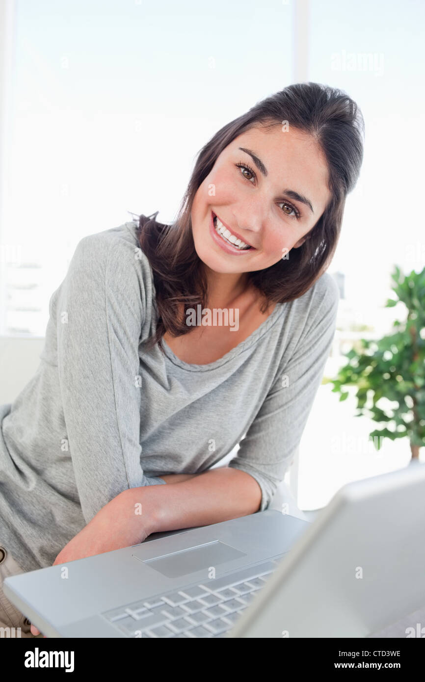 Portrait of a beaming woman using a personal computer Stock Photo - Alamy
