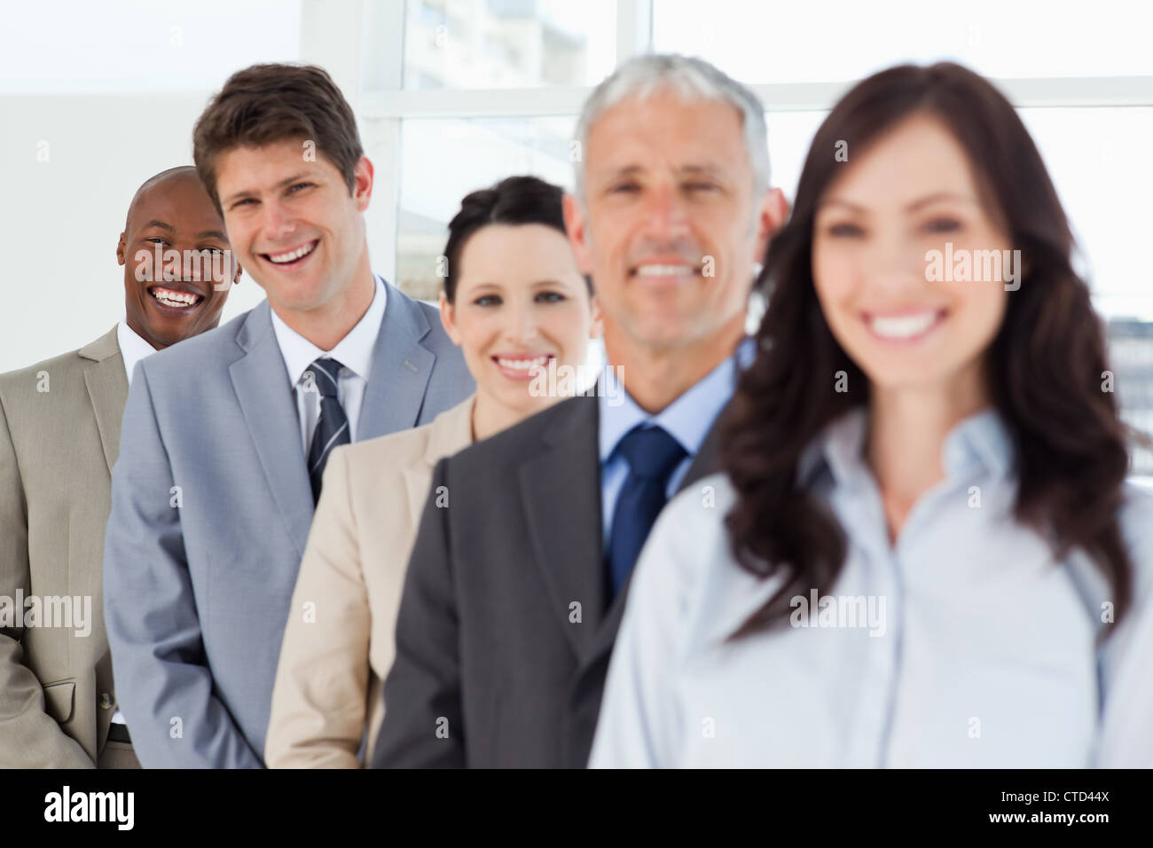 Two young executives laughing in the background while following their ...