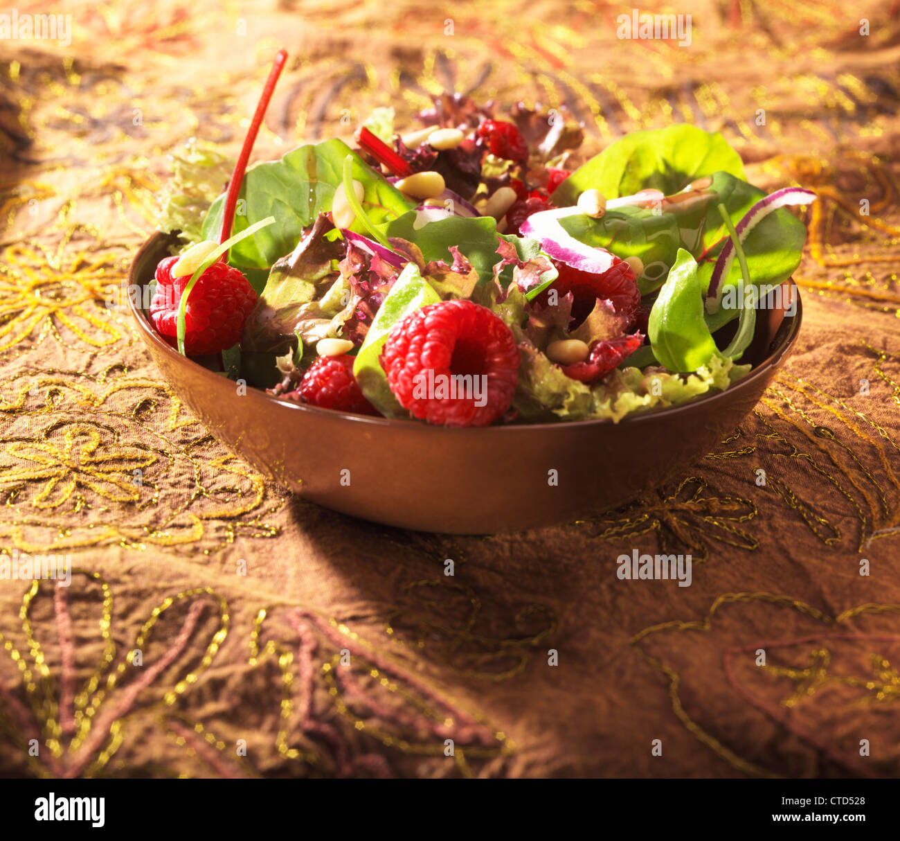 warm setting with salad in sun light Stock Photo - Alamy