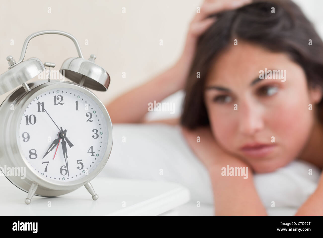 Close-up of a half asleep brunette needs to wake-up Stock Photo - Alamy