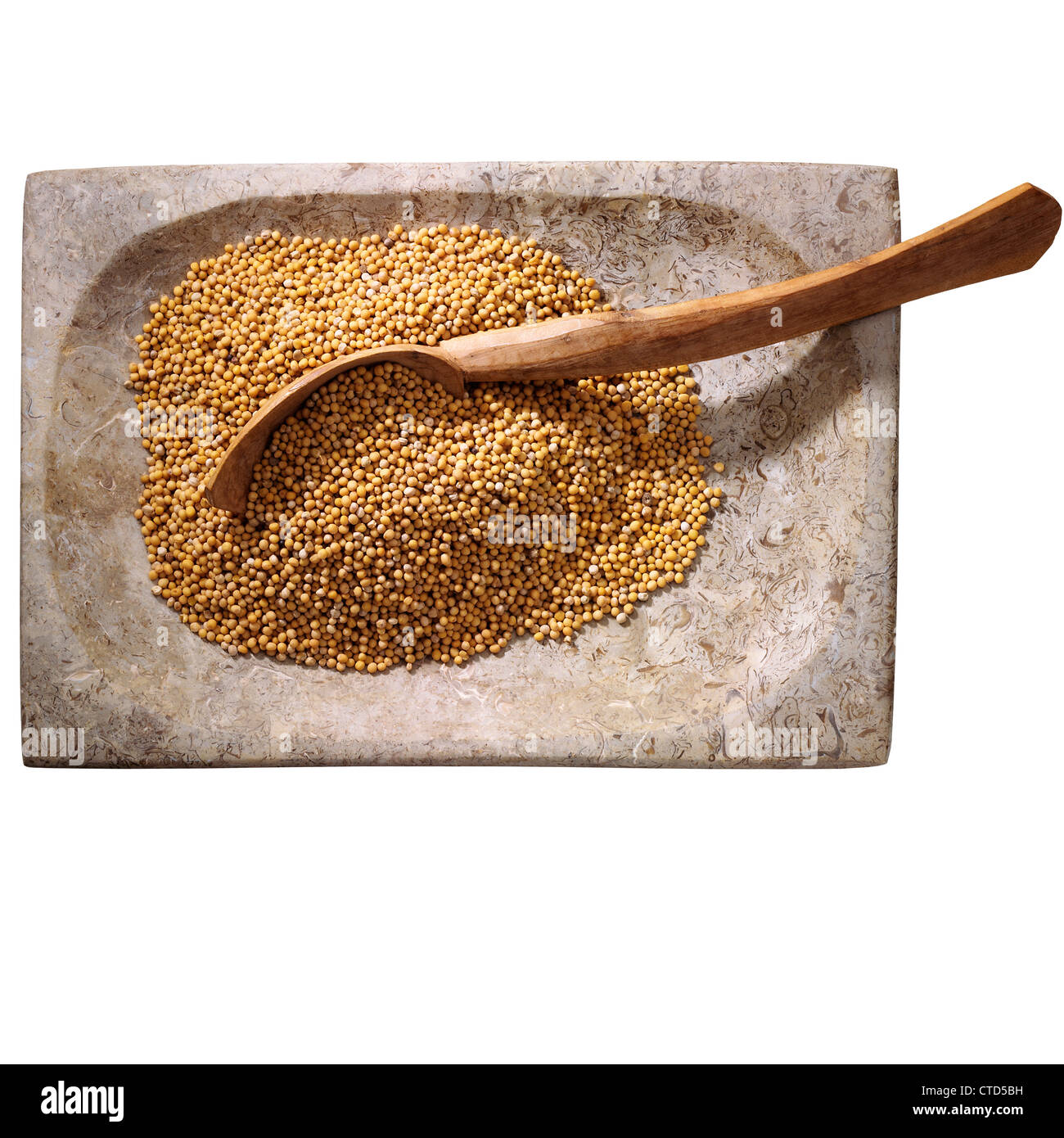Mustard seed in a stone bowl on white Stock Photo - Alamy