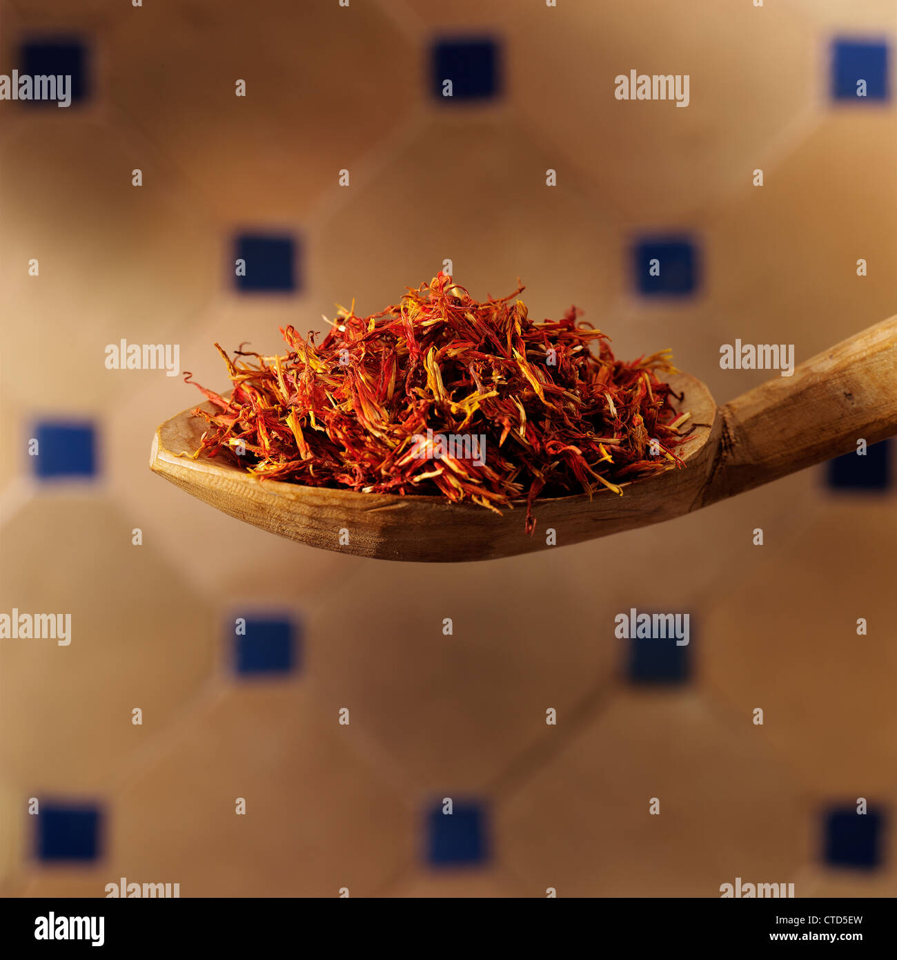 Spoon filled with saffron Stock Photo - Alamy