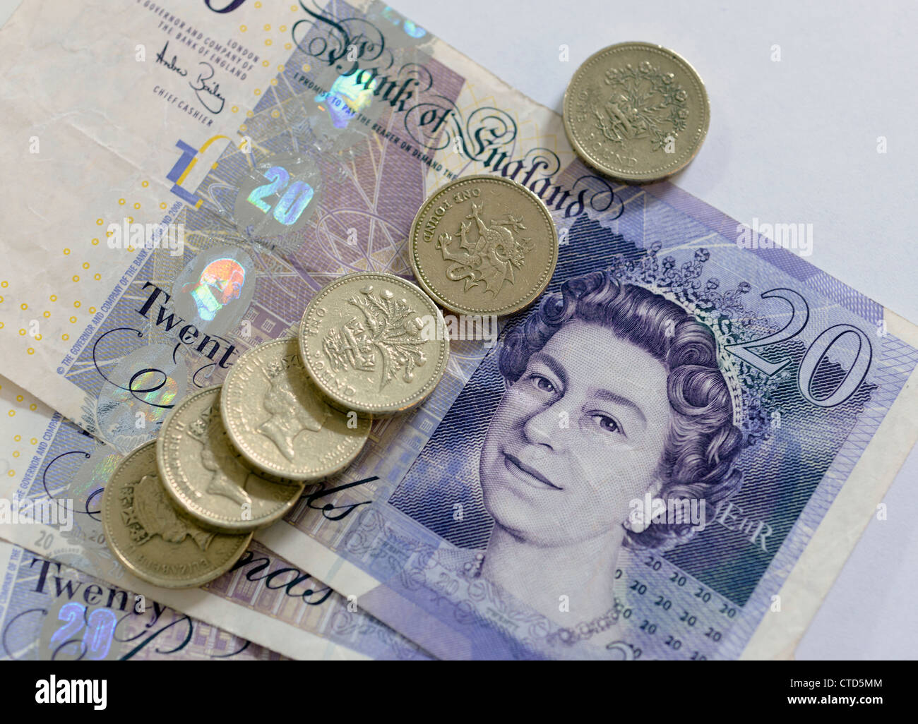 20 pound notes and one pound coins Stock Photo - Alamy