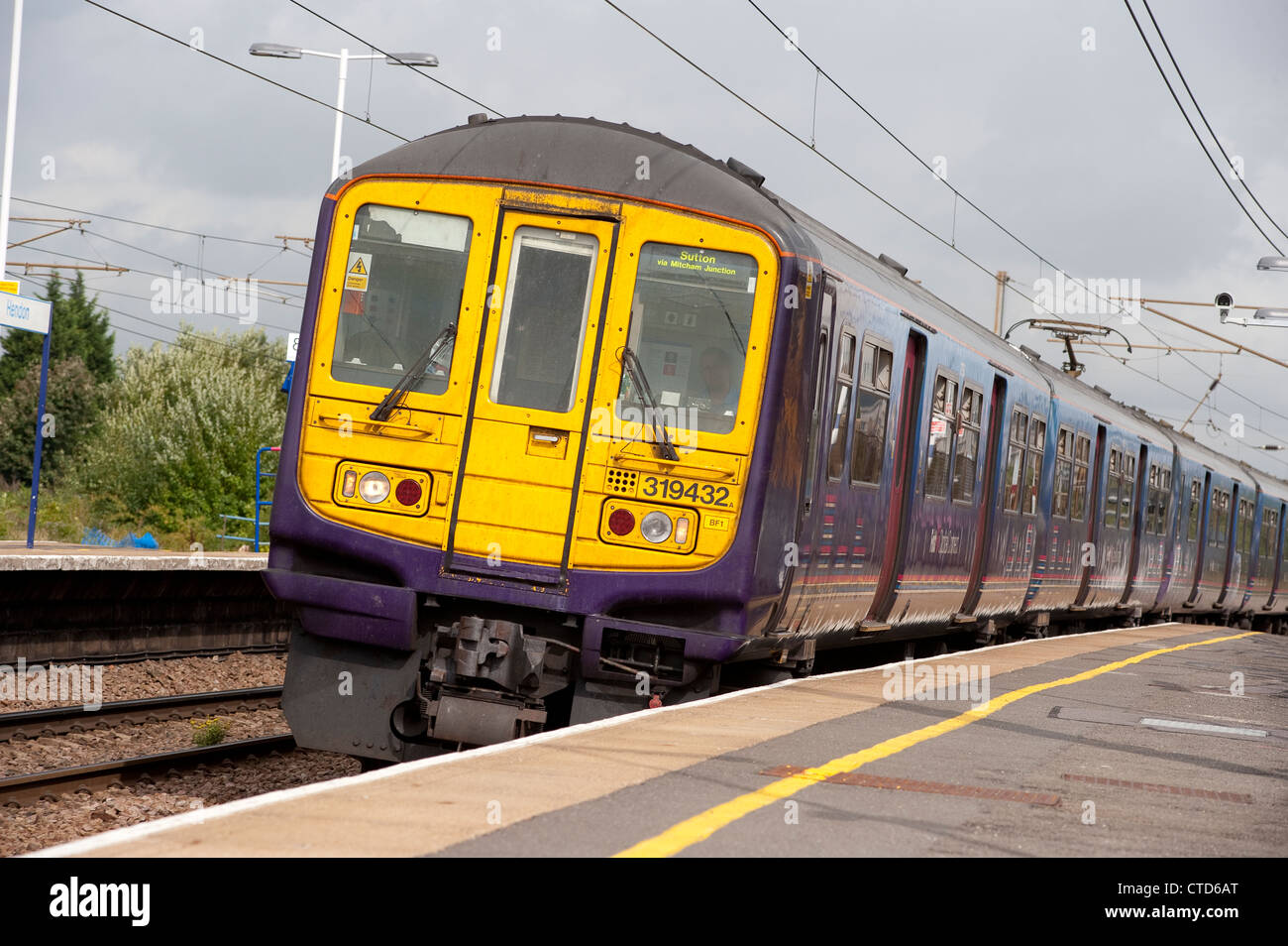 Class 319 passenger train in First Capital Connect livery approaching a ...