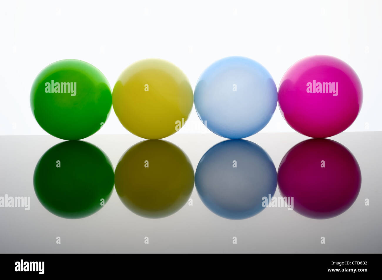 Colored balls on the dark surface Stock Photo - Alamy