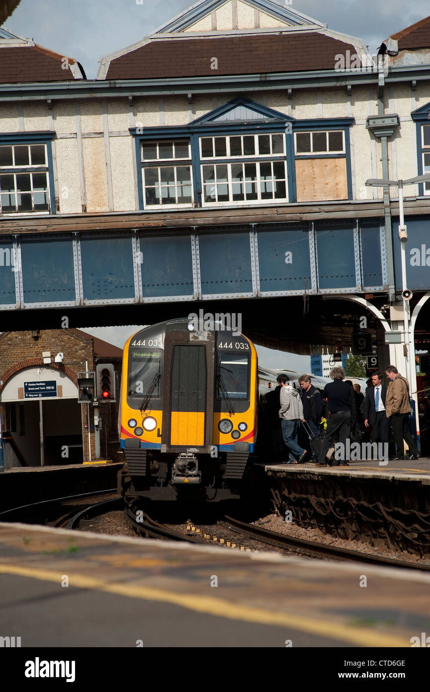 Passengers boarding a class 444 train in South West Trains livery at ...
