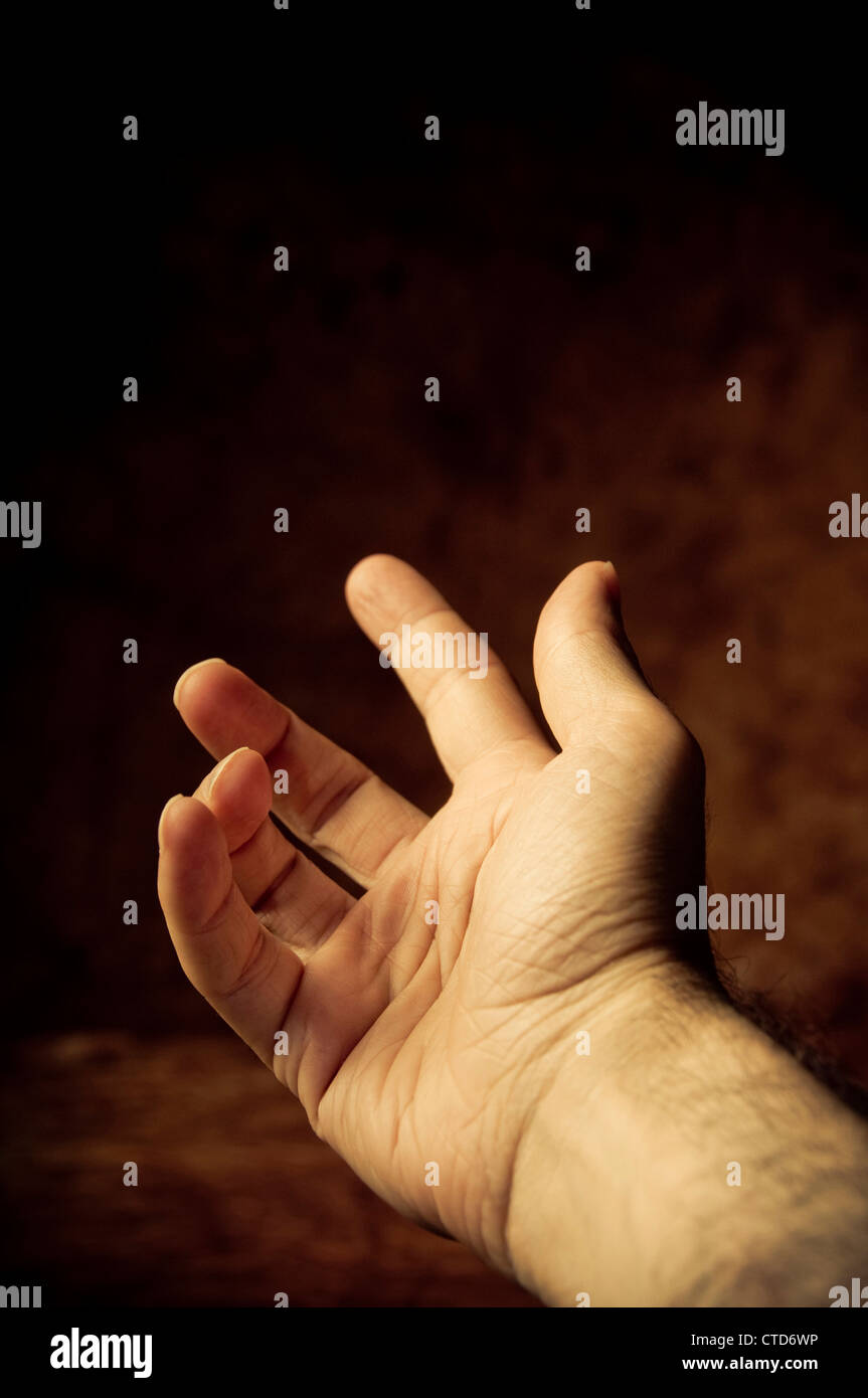 open male hand in a gesture of hope and giving Stock Photo - Alamy
