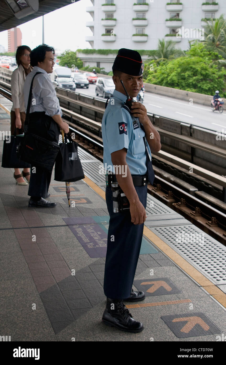 At every sky train station in Bangkok, there is a security guard ...