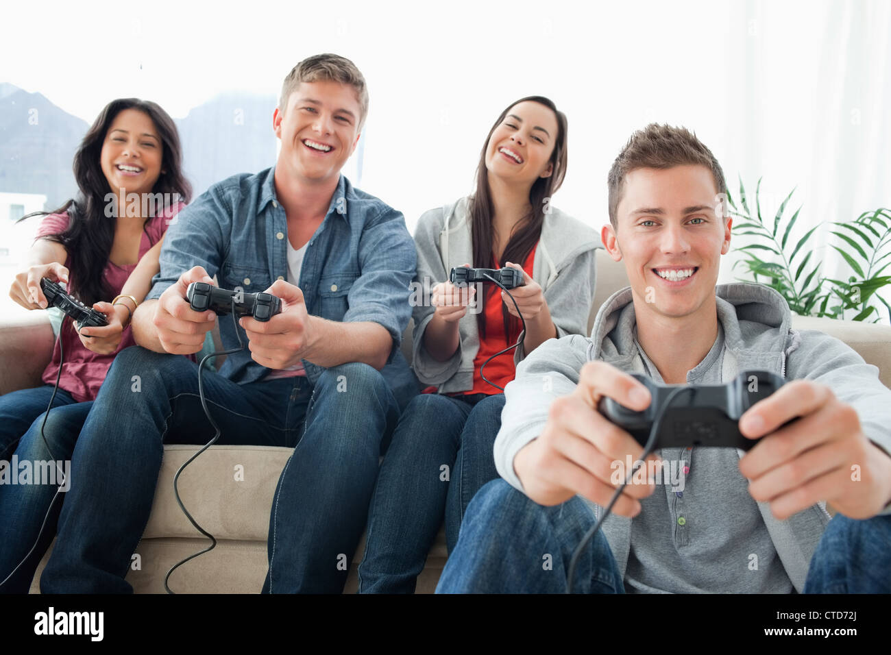 Happy group young friends play hi-res stock photography and images - Alamy