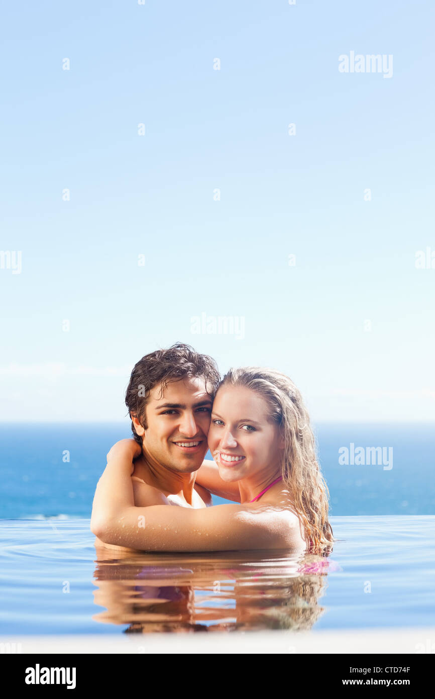 Woman in bikini hugging swimming hi-res stock photography and images ...