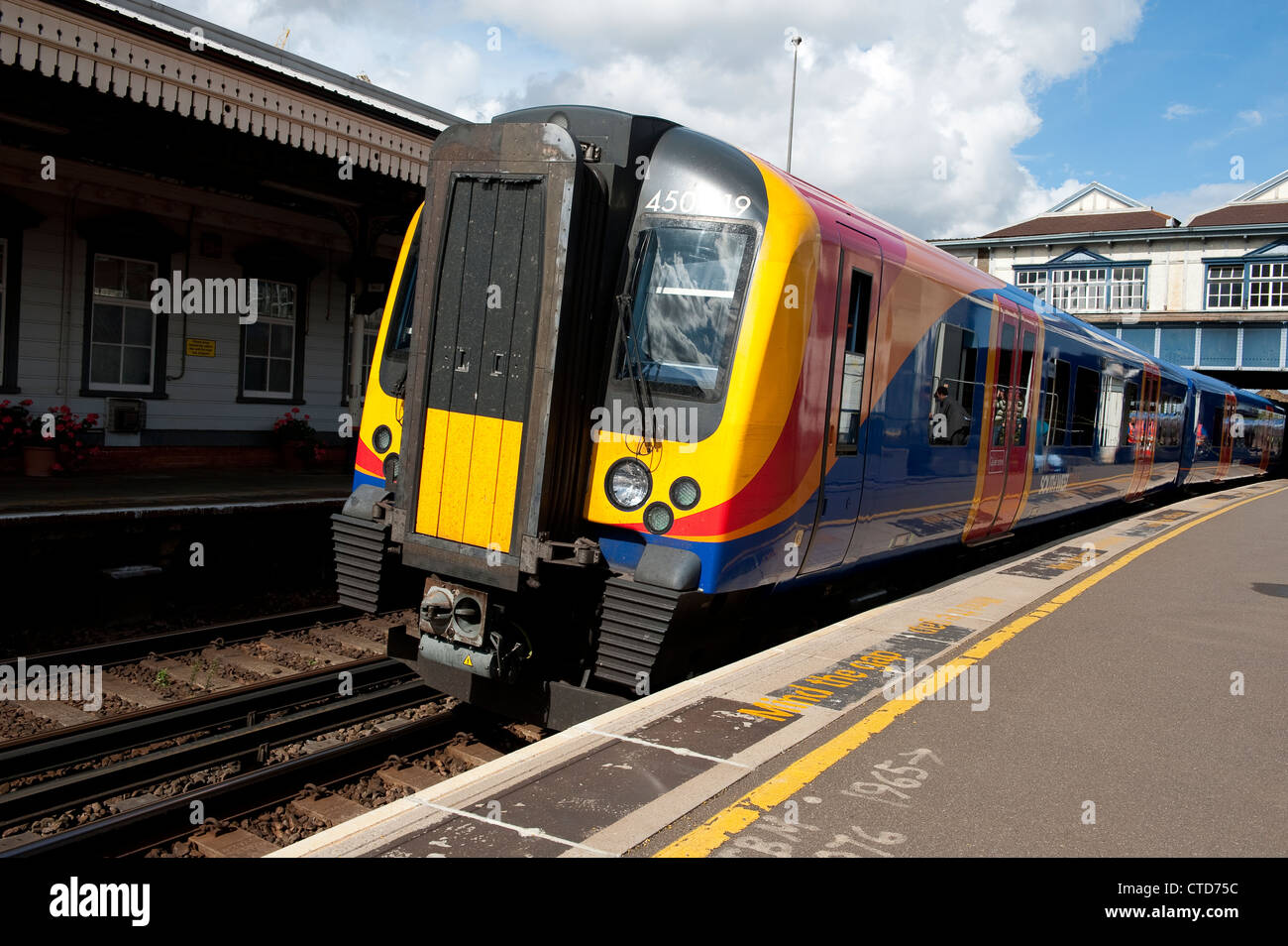 Class 450 passenger train in South West Trains livery approaching a ...