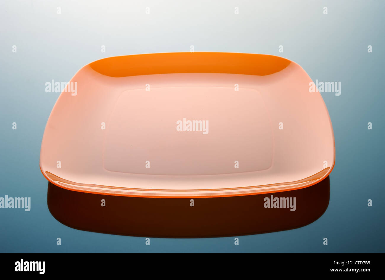 Rectangular plate on a dark reflective surface Stock Photo - Alamy