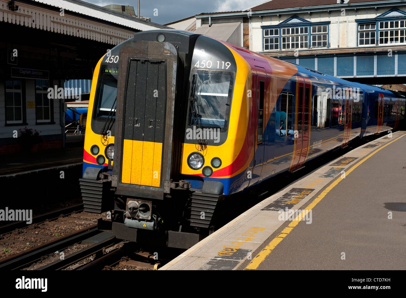Class 450 passenger train in South West Trains livery approaching a ...