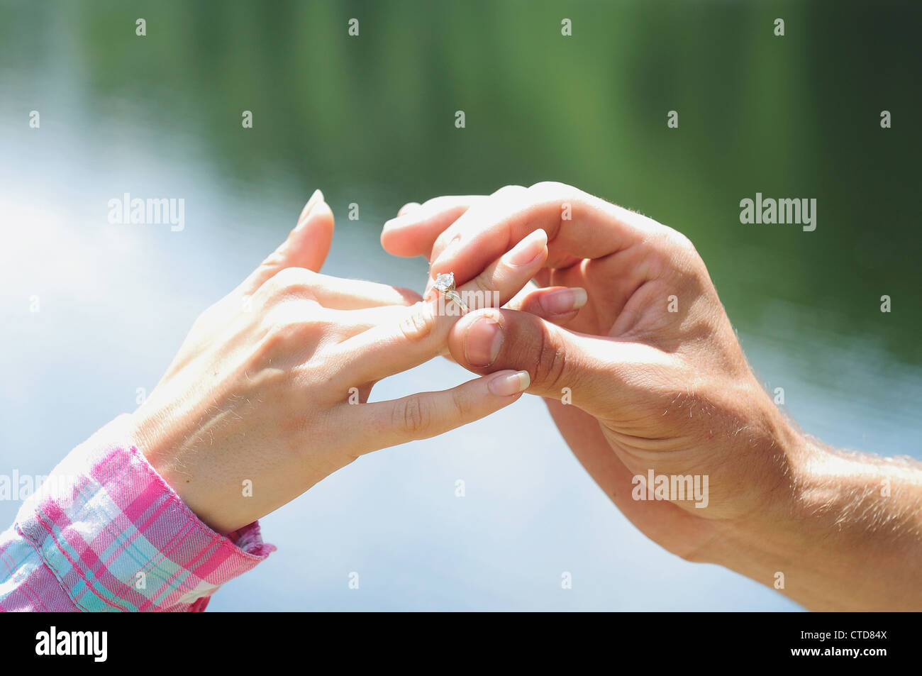 Closeup of giving the ring in nature Stock Photo - Alamy