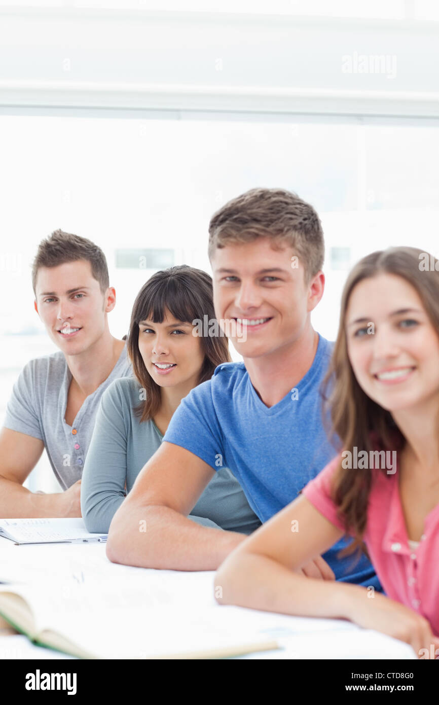 A group of young adults smiling as they all look at the camera Stock ...