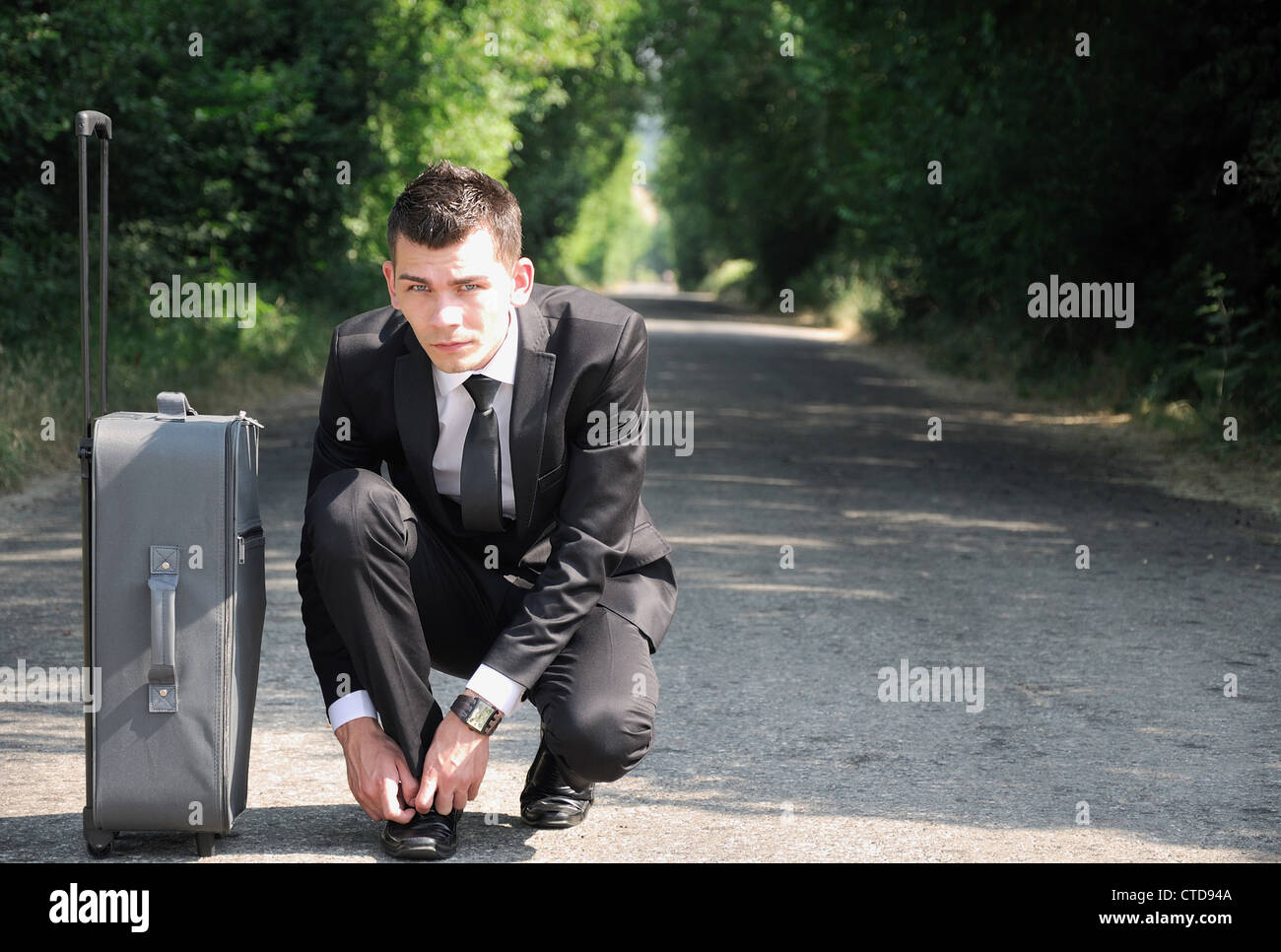Business man ready to go on road Stock Photo - Alamy