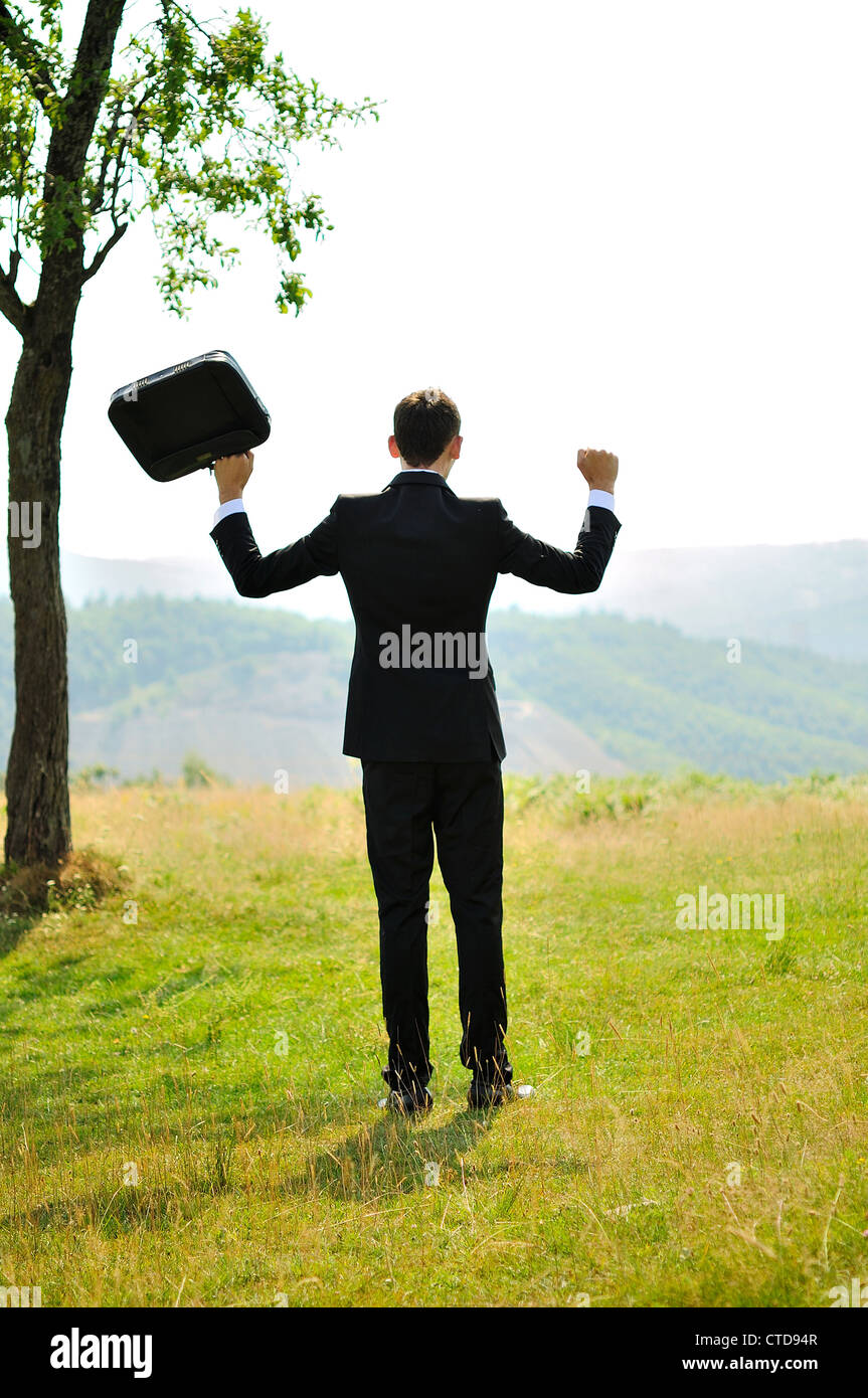 Business man excited in nature Stock Photo - Alamy