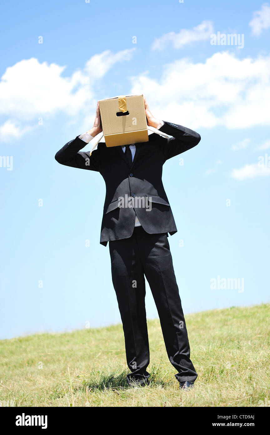 Business man box on head hi-res stock photography and images - Alamy
