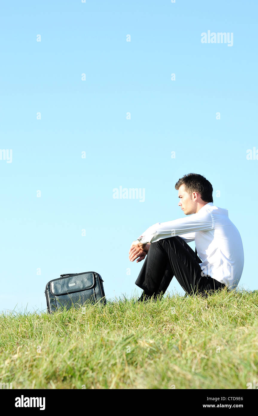 Business man standing upset in nature Stock Photo - Alamy
