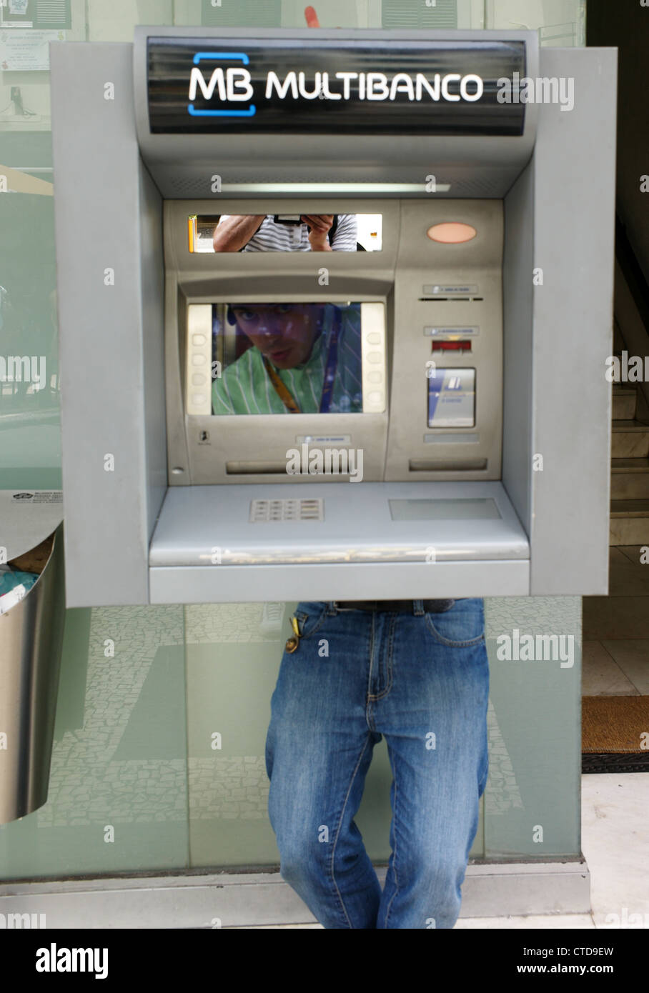 Human cash machine? This man was fixing the cash machine - he is behind ...