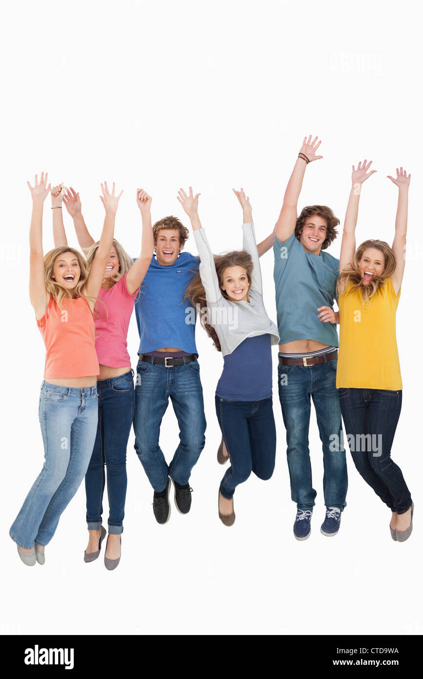 Celebrating friends jumping in the air Stock Photo - Alamy
