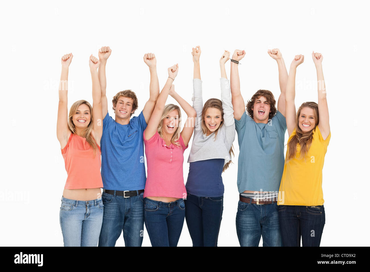 Smiling people raising hands up in the air Stock Photo - Alamy