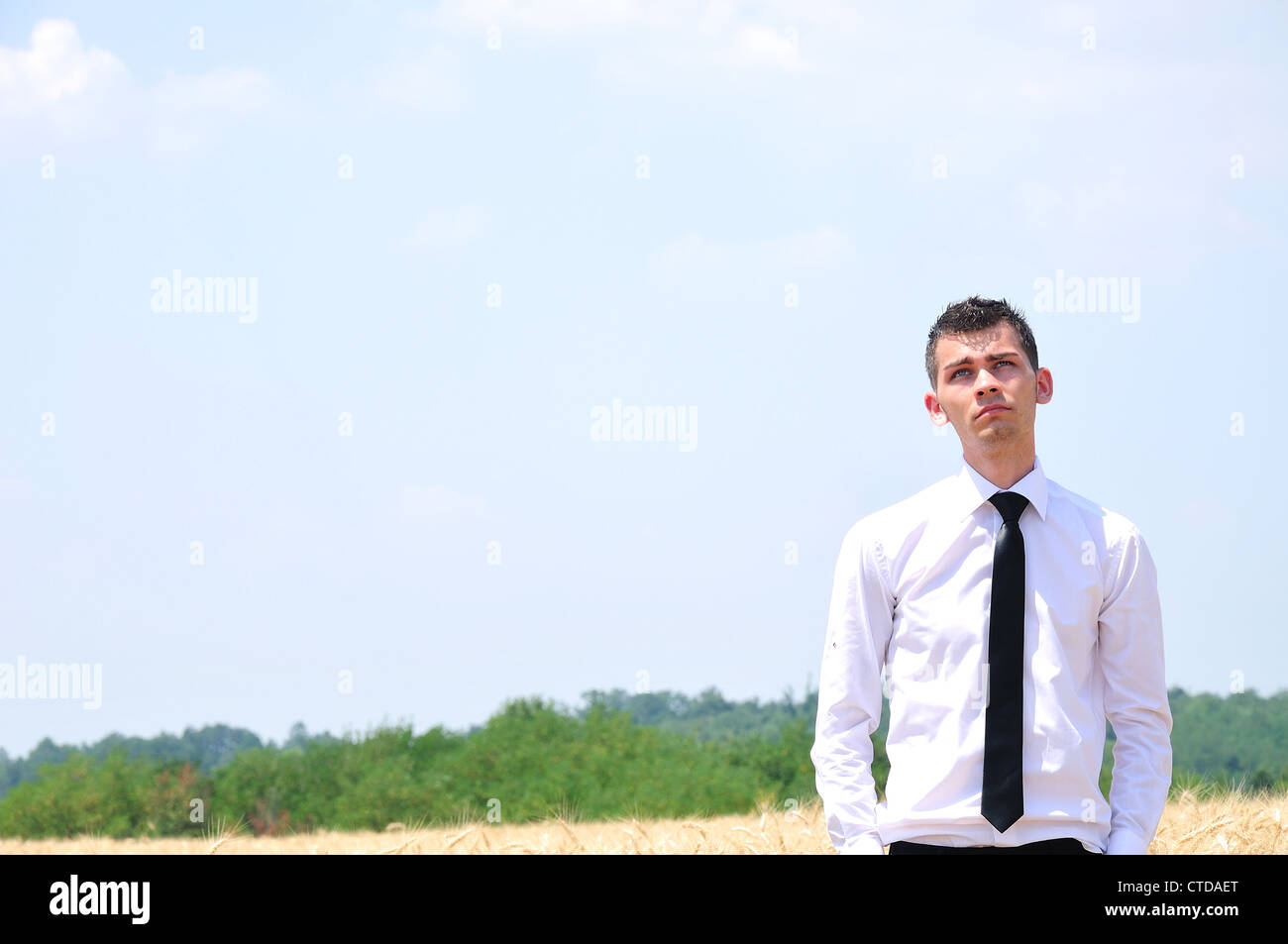 Business man thinking in nature Stock Photo - Alamy