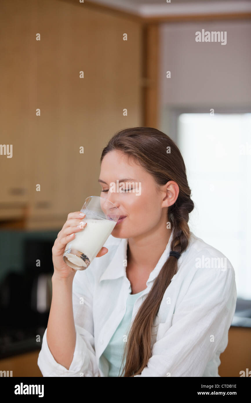 Women drinking a glass of milk Stock Photo - Alamy