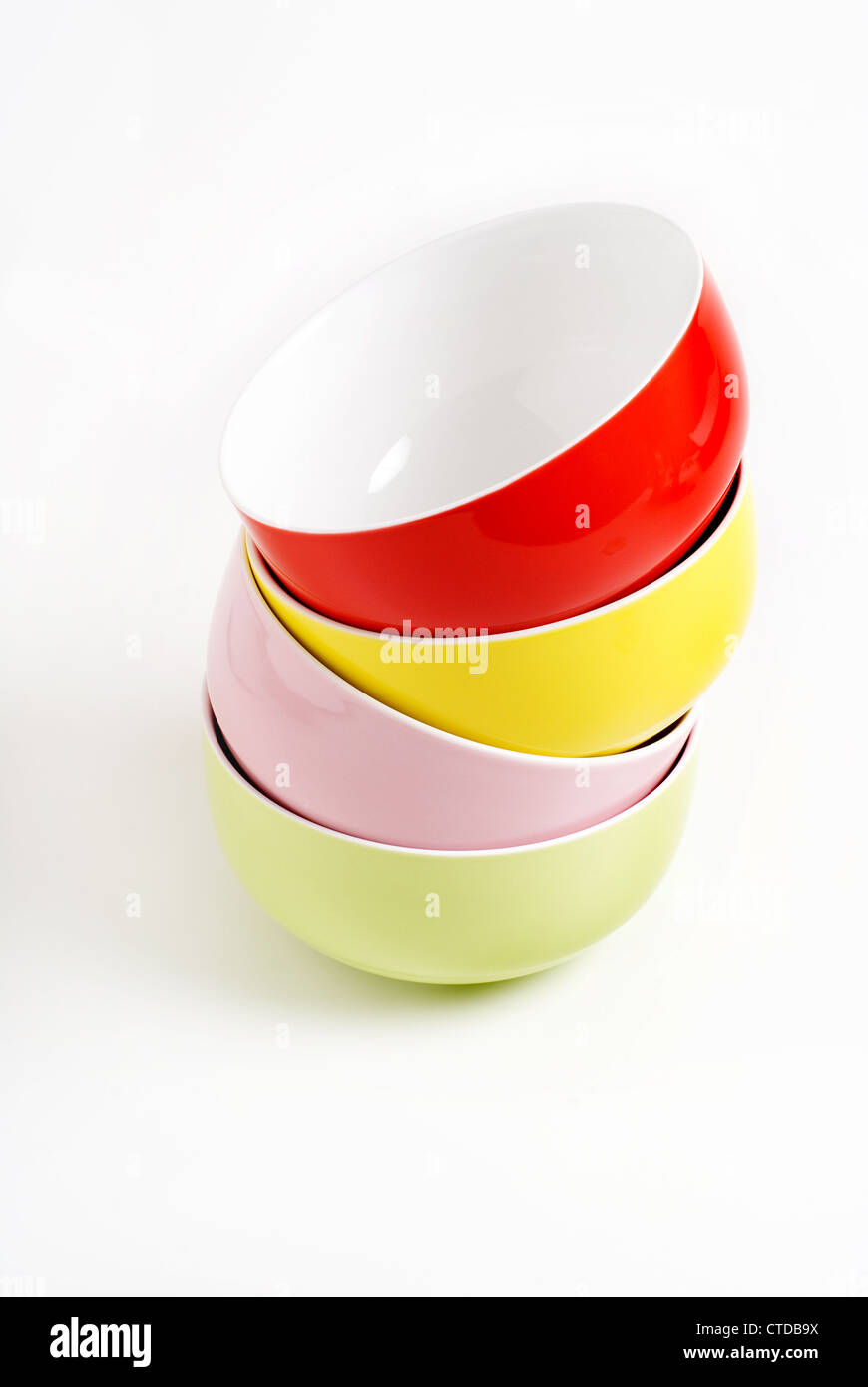 Stack of colourful food bowels on white background.r Stock Photo - Alamy