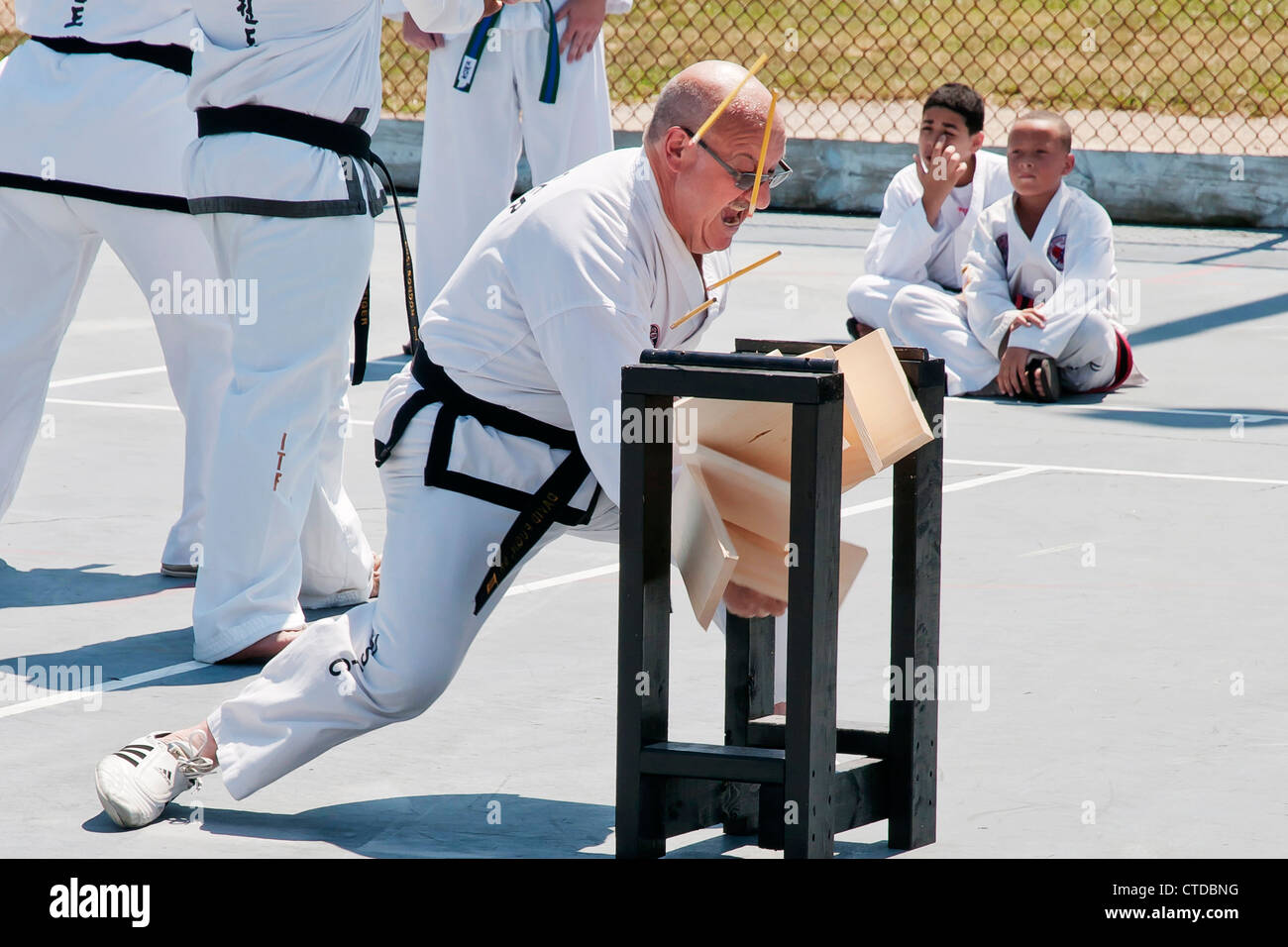 A veteran of karate demonstrates the knockout blow at the feast of one ...