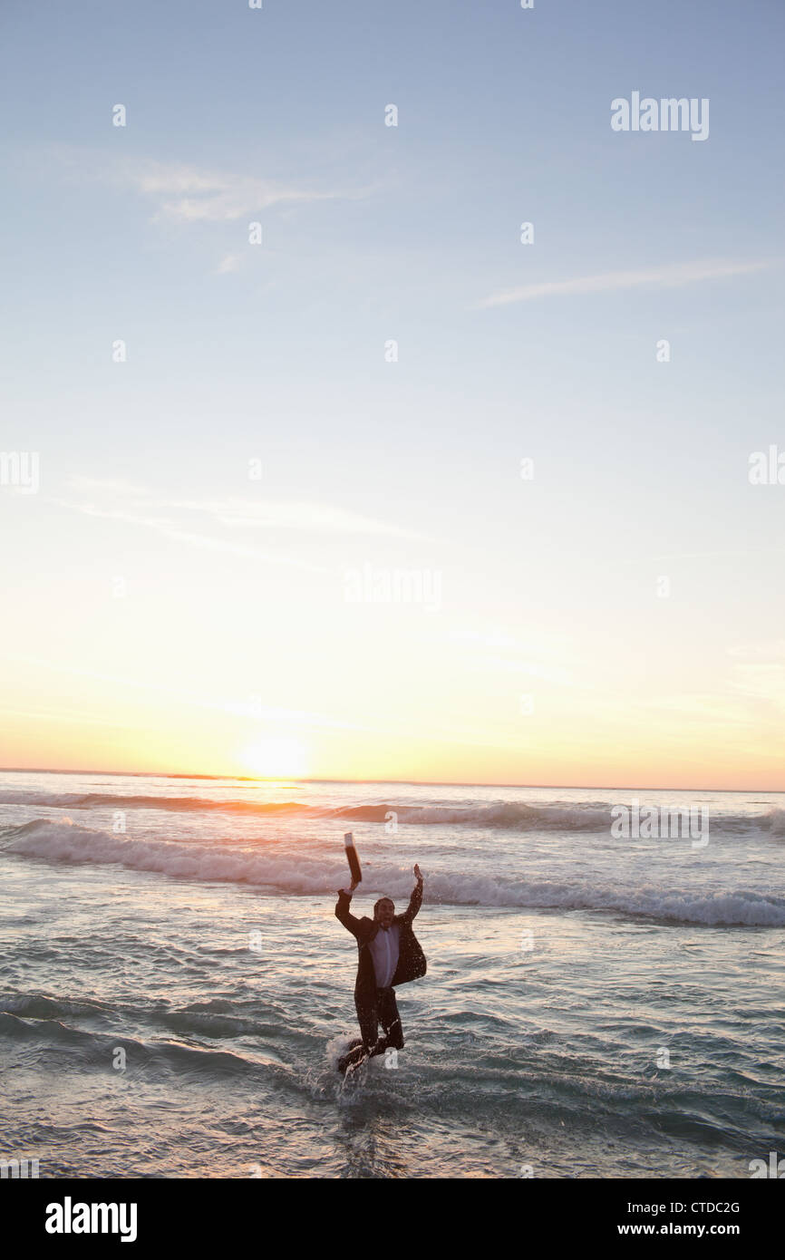 Jumping in waves hi-res stock photography and images - Alamy