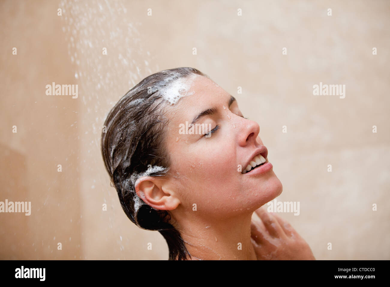 Woman washing her hair in the shower Stock Photo - Alamy