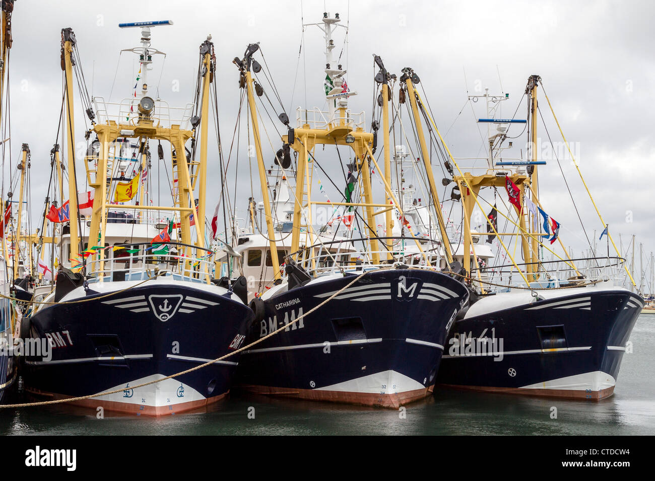fishing boats in line Stock Photo - Alamy