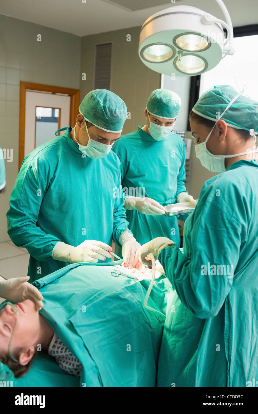 Female patient lying on operating table Stock Photo - Alamy