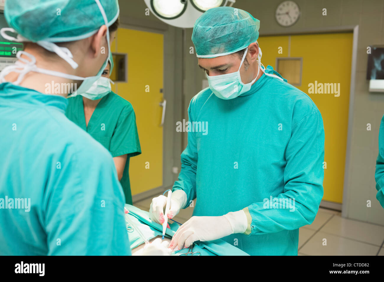 View of a male surgeon using a surgical tool Stock Photo - Alamy