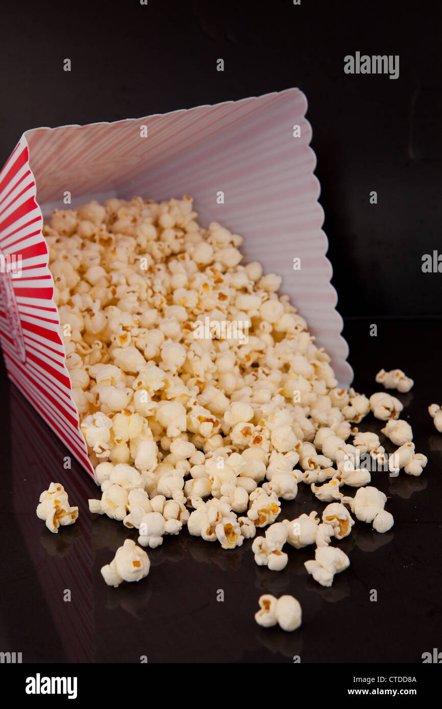 Pop corn falling out of box Stock Photo - Alamy