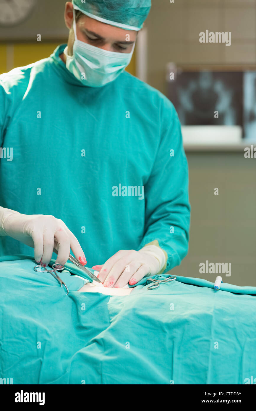 Close up of a surgeon opening a patient Stock Photo - Alamy
