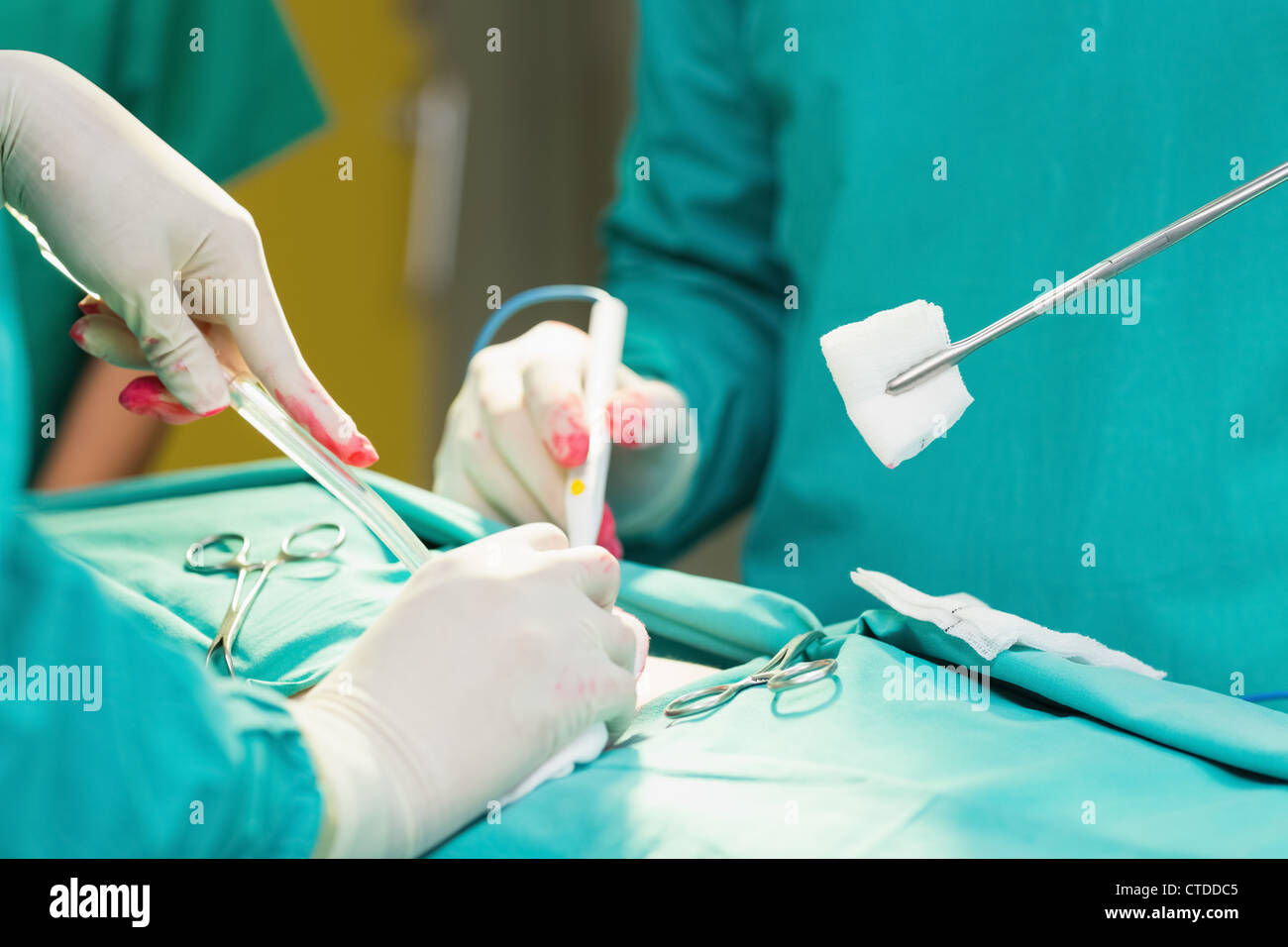 Close up of a surgeon holding surgical tools Stock Photo - Alamy