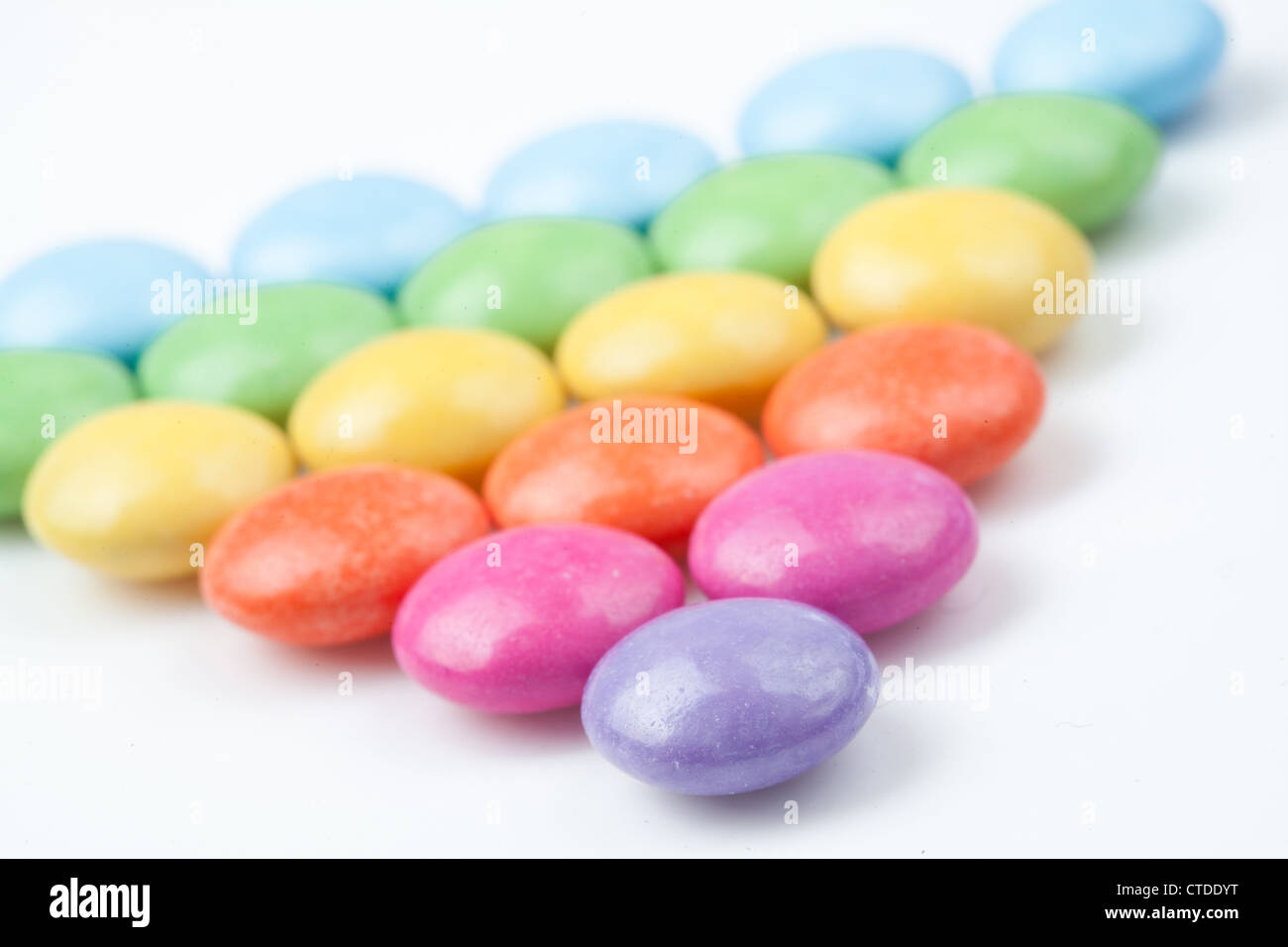 Triangle of candies Stock Photo - Alamy