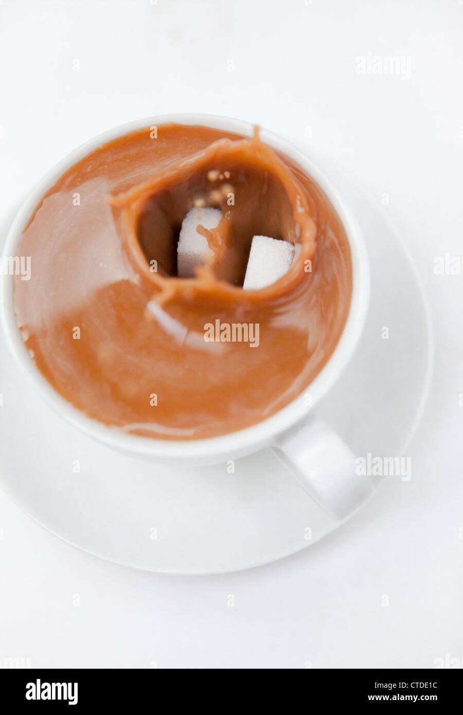 Sugar lump falling hi-res stock photography and images - Alamy