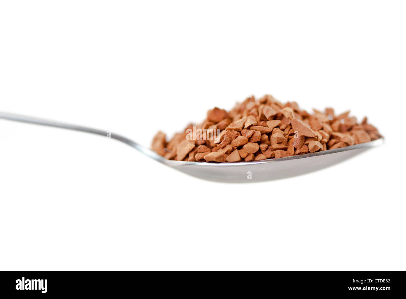 Spoon with chocolate powder Stock Photo - Alamy