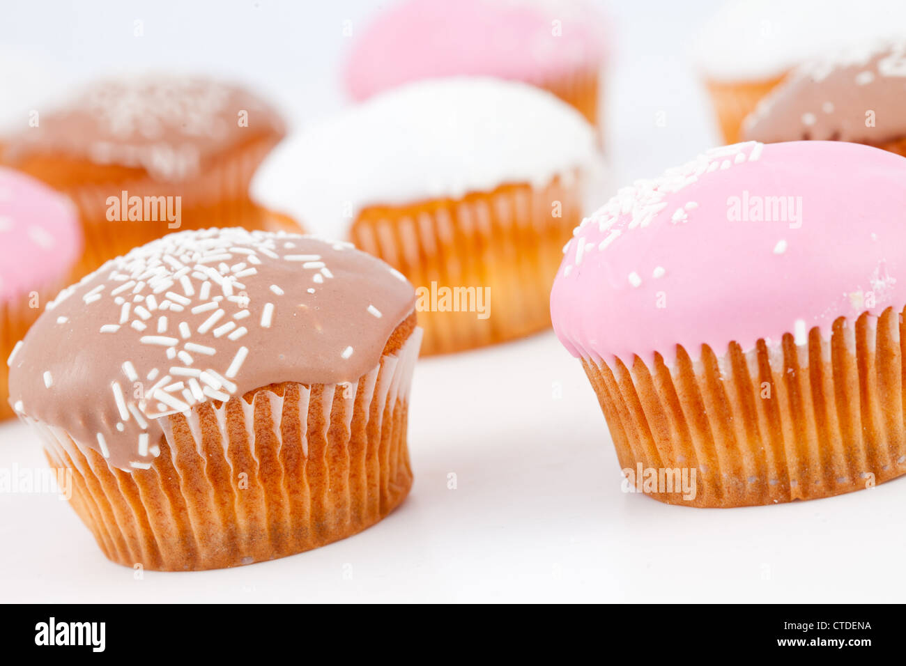 Muffins with icing sugar placed together Stock Photo - Alamy