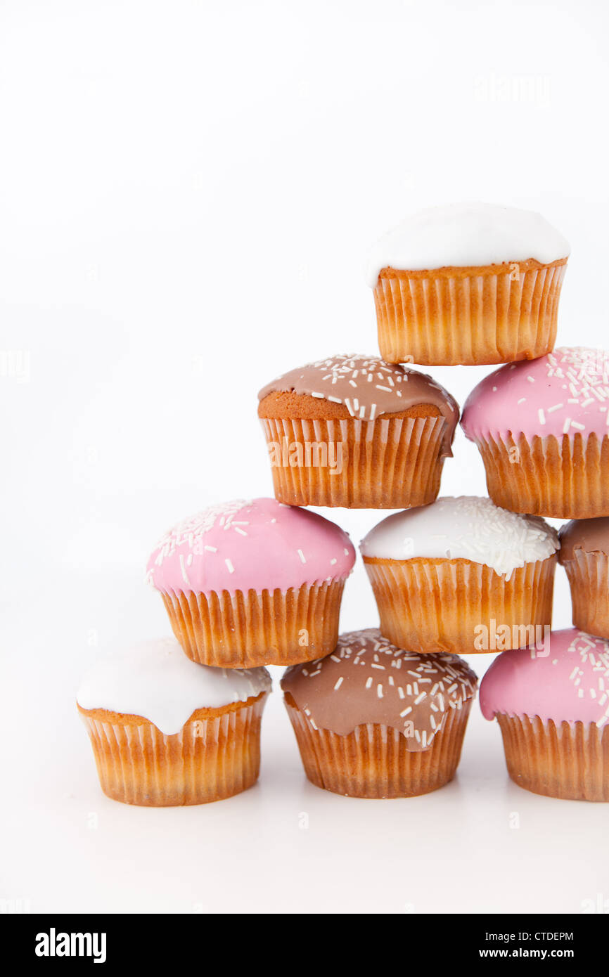 Many muffins with icing sugar placed in pyramid Stock Photo - Alamy