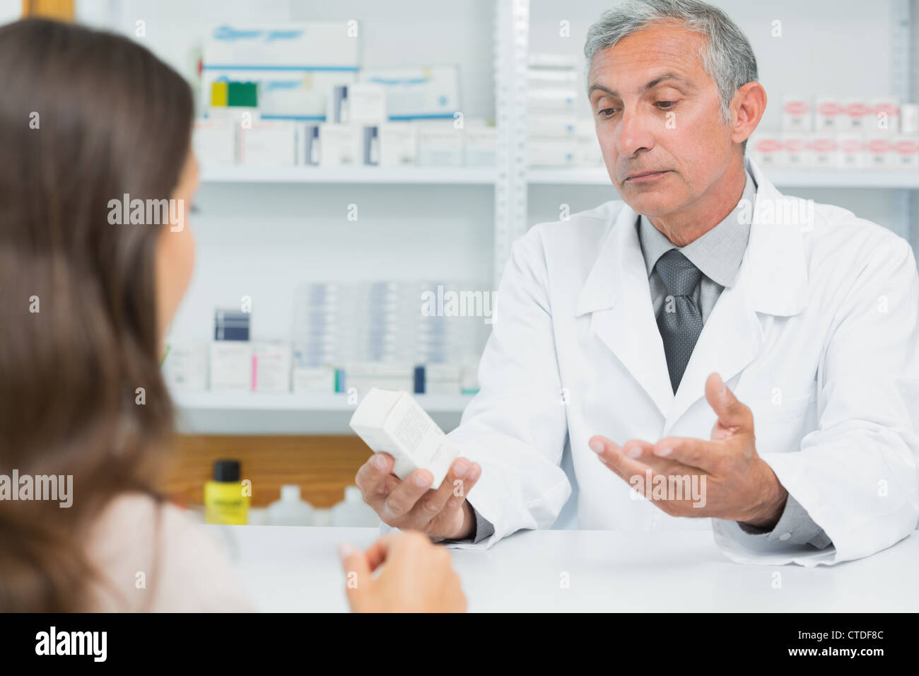 Pharmacist talking to customer hi-res stock photography and images - Alamy