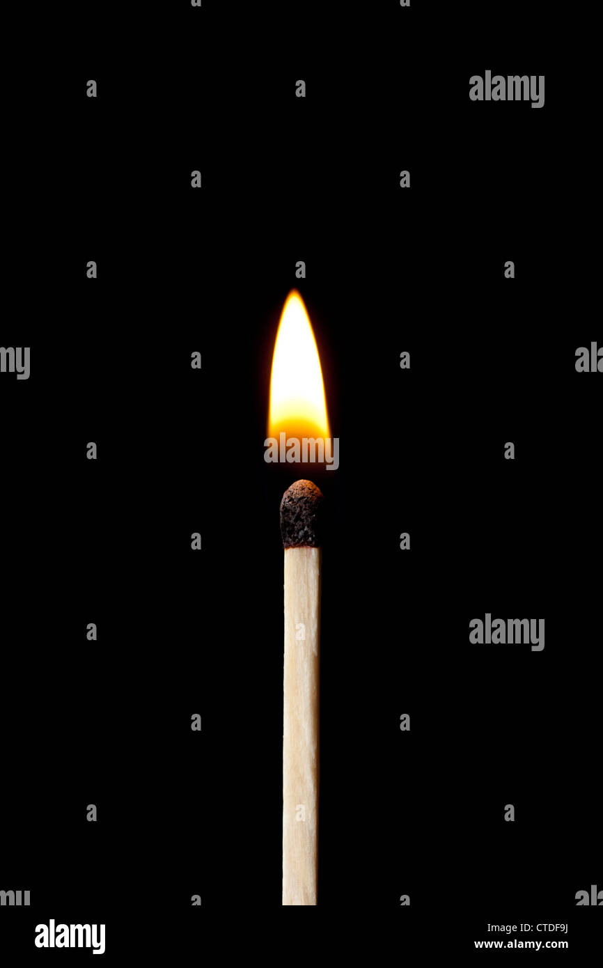 Vertical match on fire Stock Photo - Alamy
